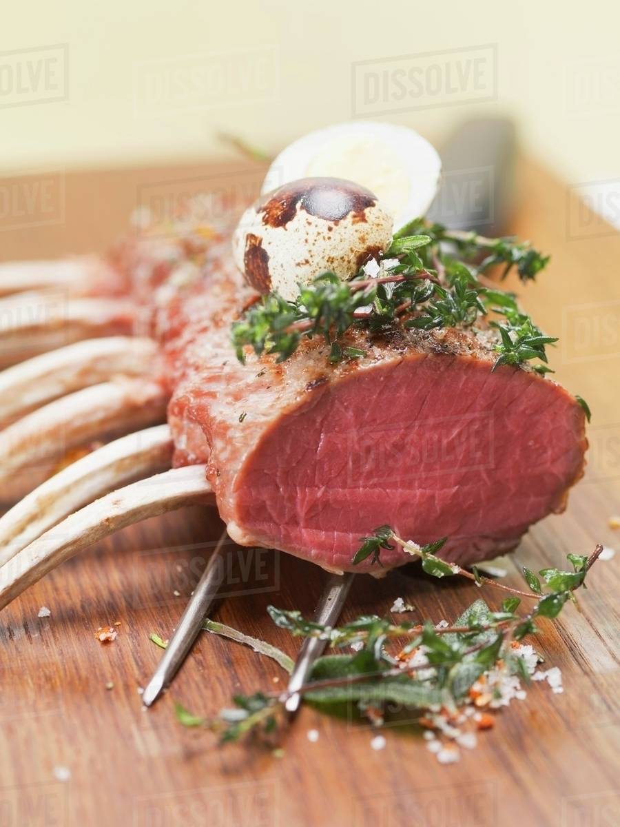 Rack of lamb with herbs and quail's egg - Royalty-free Stock Photo ...