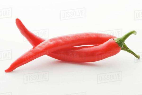Two red chillies - Royalty-free Stock Photo | Dissolve