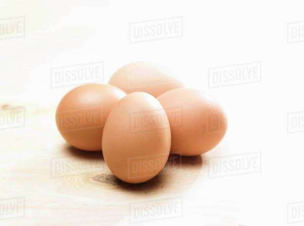 Four hens' eggs - Stock Photo - Dissolve