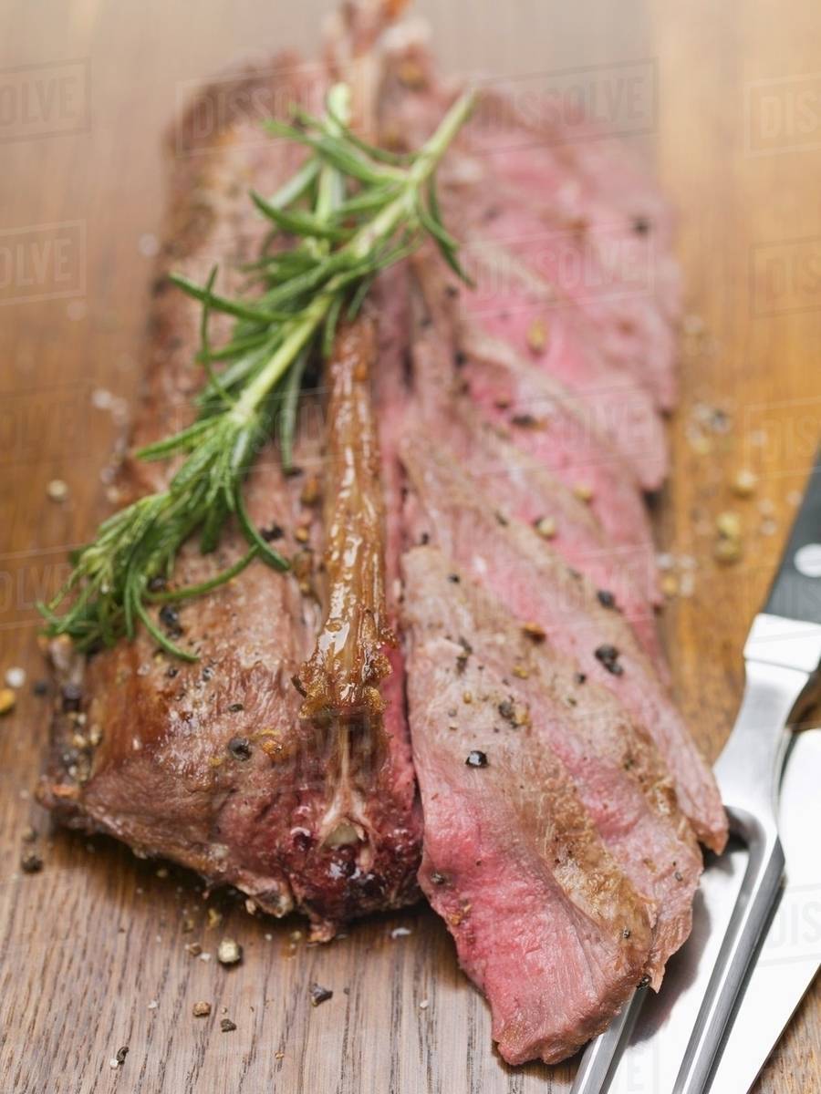 Roast saddle of venison with rosemary - Royalty-free Stock Photo | Dissolve