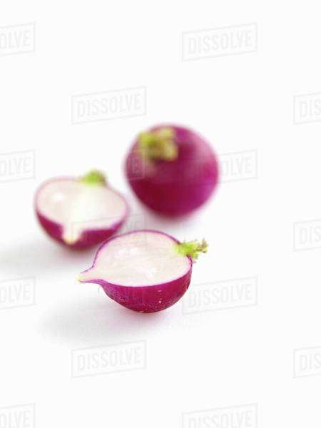 Radishes, one whole, one halved - Royalty-free Stock Photo | Dissolve