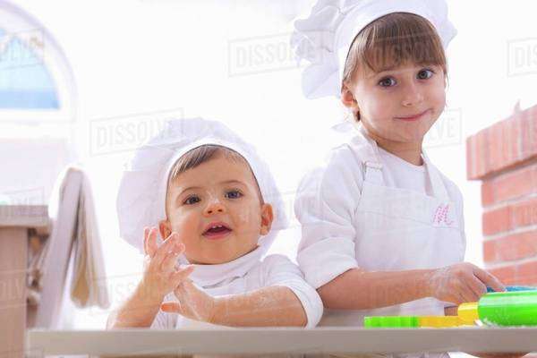 Two girls baking - Stock Photo - Dissolve
