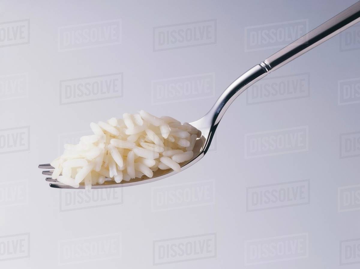 Cooked rice on fork - Royalty-free Stock Photo | Dissolve
