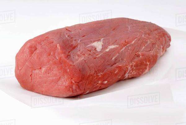Fresh beef fillet on paper - Stock Photo - Dissolve