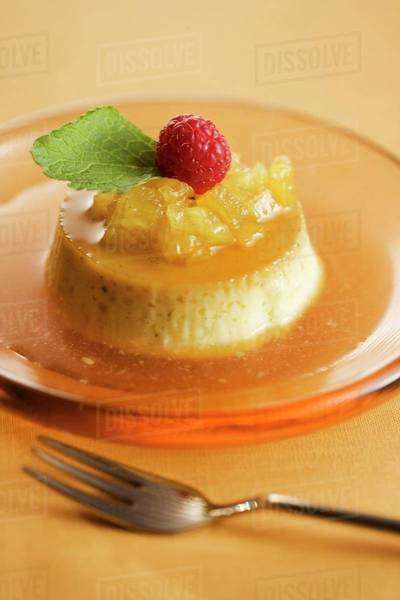 Flan with Fruit Sauce and Fresh Raspberry Garnish - Royalty-free Stock ...