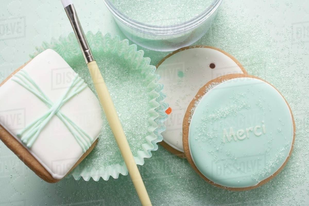 Pastel-coloured biscuits with coloured sugar (close-up) - Royalty-free ...