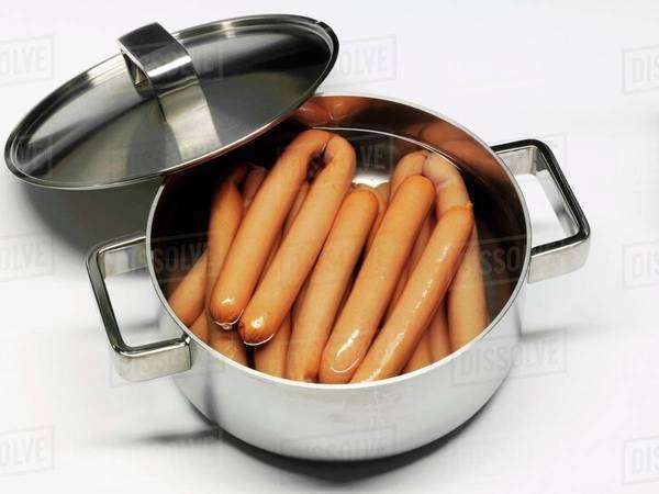 Bockwurst (German sausages) in a pan - Stock Photo - Dissolve