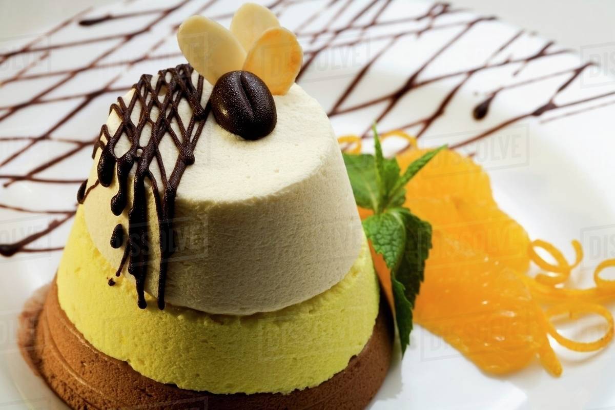 Three-coloured mousse cake with chocolate decoration - Royalty-free ...