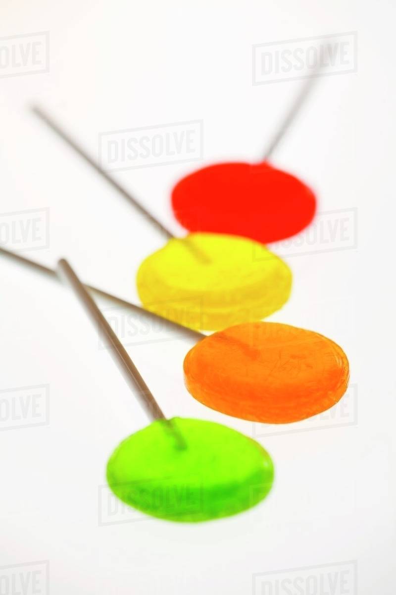 Four coloured lollipops - Stock Photo - Dissolve