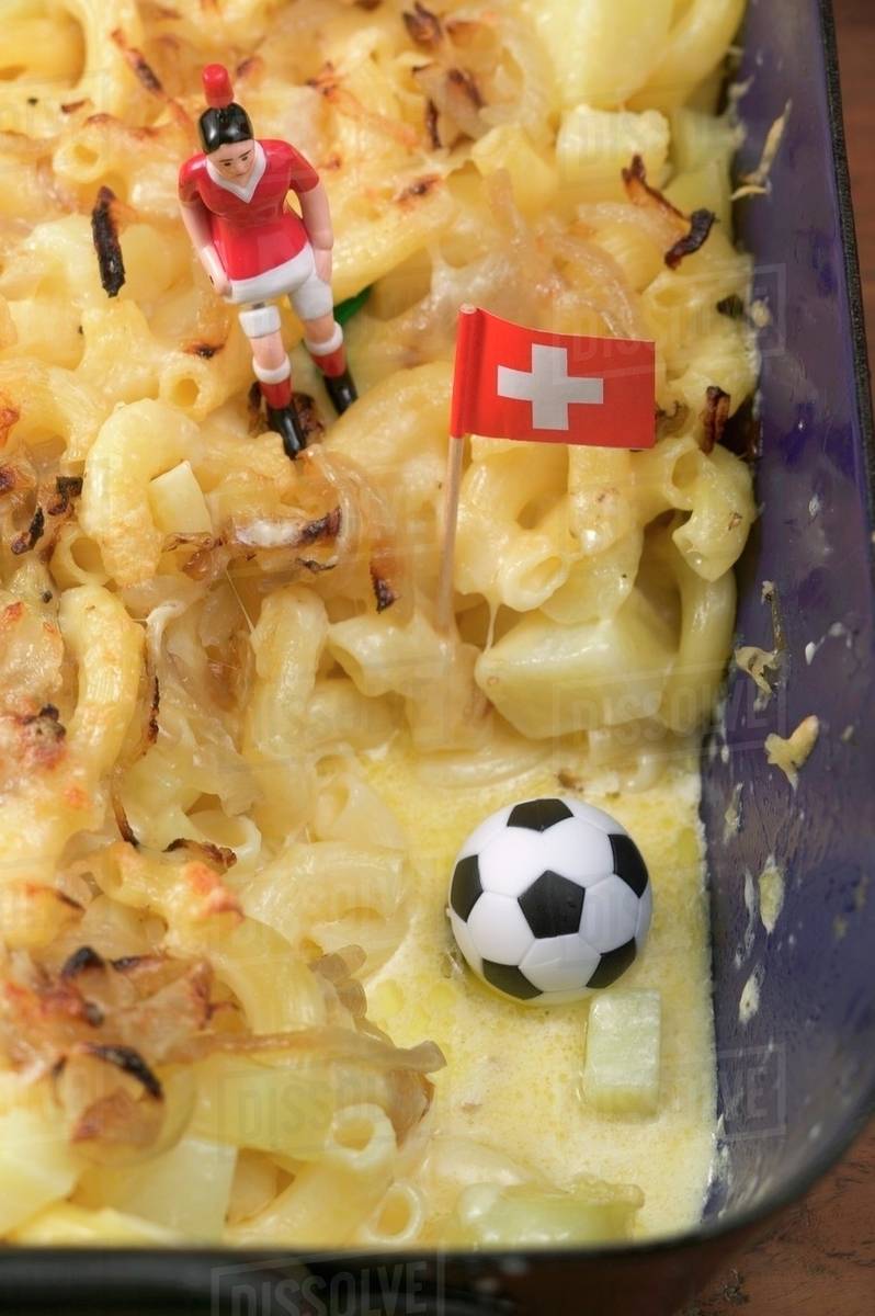 Cheese & onion pasta bake, football figure, football, flag (detail ...