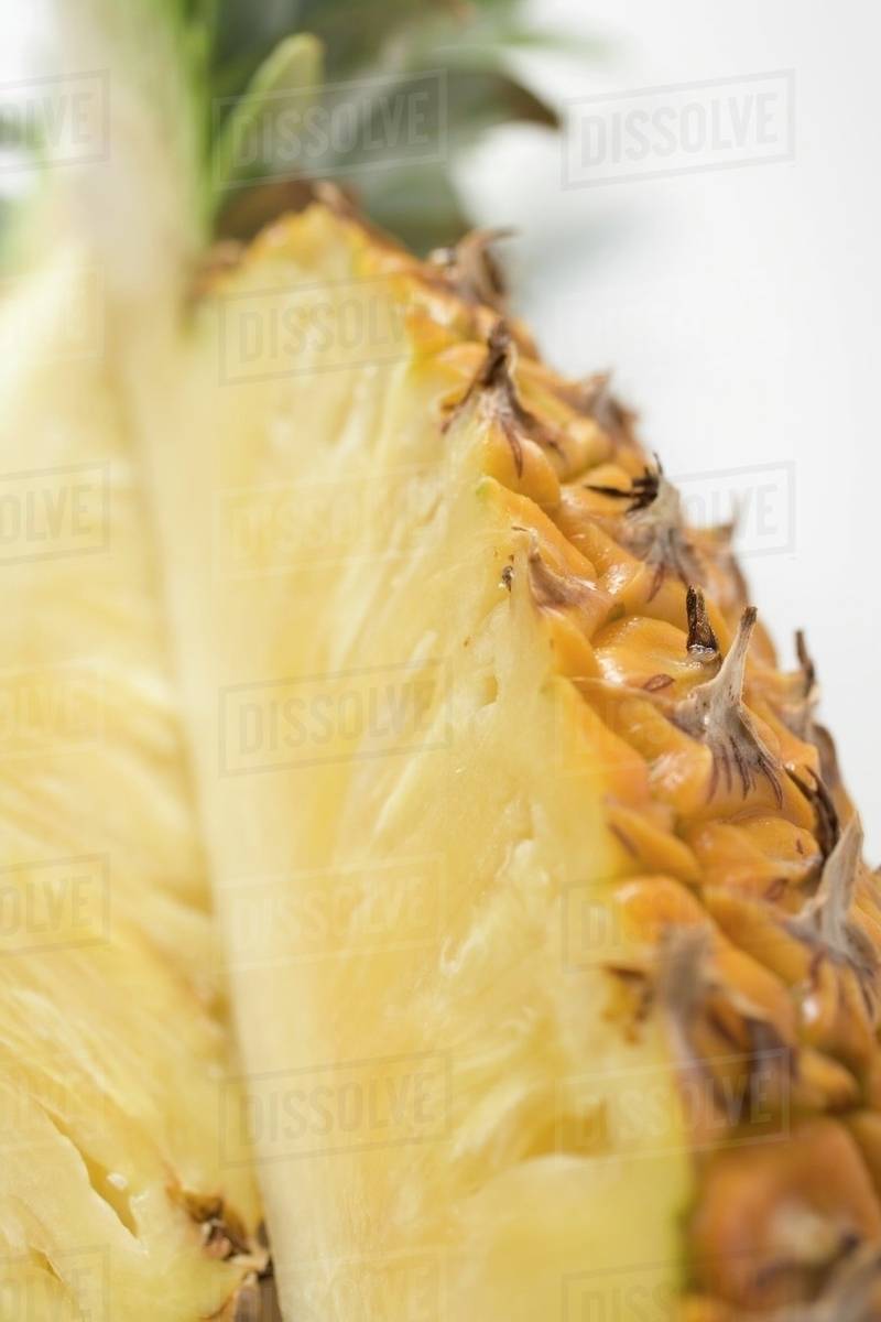 Two pineapple quarters (close-up) - Royalty-free Stock Photo | Dissolve