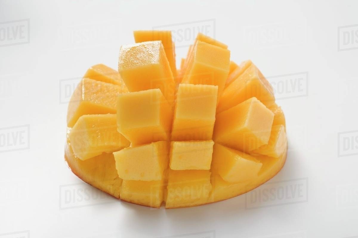 Diced mango still attached to the skin - Royalty-free Stock Photo ...
