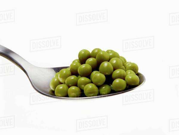 Peas on spoon - Royalty-free Stock Photo | Dissolve