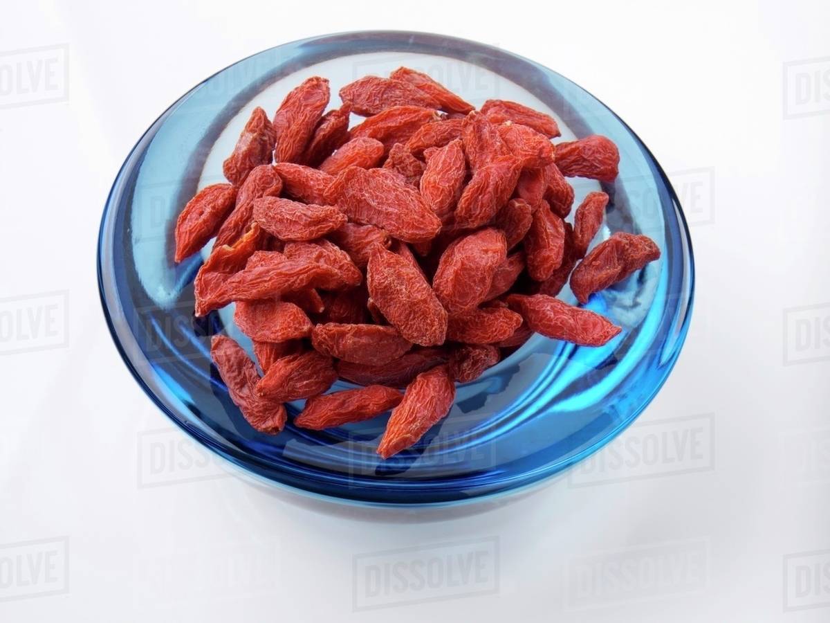 Blue Bowl of Goji Berries - Stock Photo - Dissolve