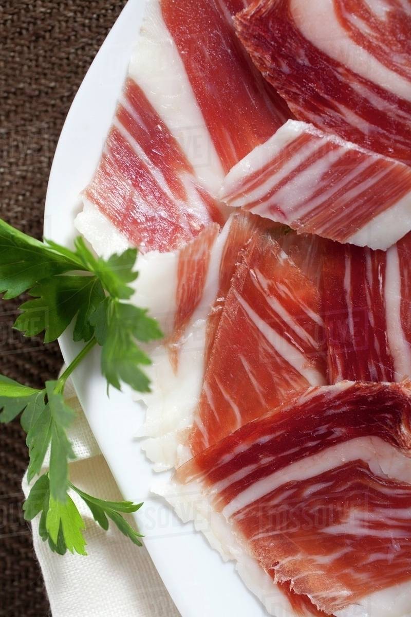 Spanish ham, cut into pieces - Royalty-free Stock Photo | Dissolve