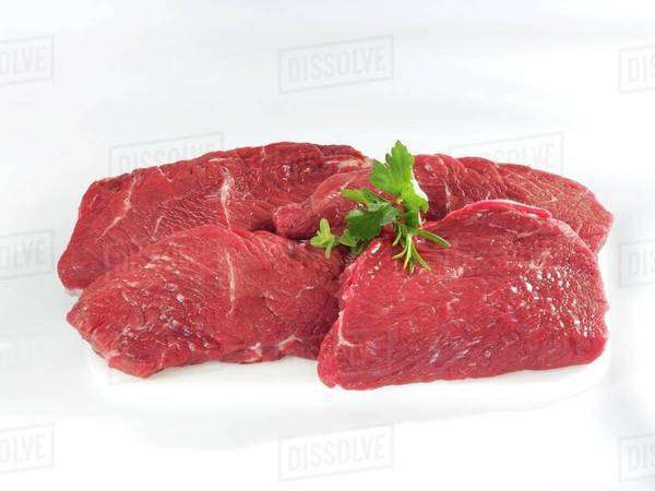 Four rump steaks (beef) - Royalty-free Stock Photo | Dissolve