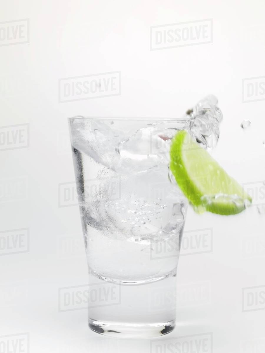 Water splashing out of a glass - Stock Photo - Dissolve