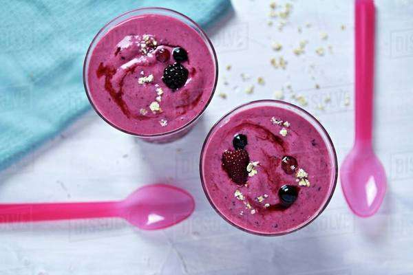 Two berry smoothies - Royalty-free Stock Photo | Dissolve