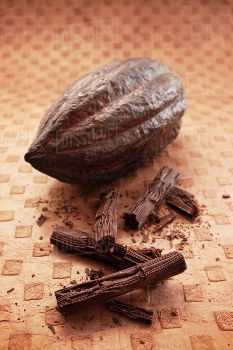 A cacao fruit and chocolate flake - Stock Photo - Dissolve