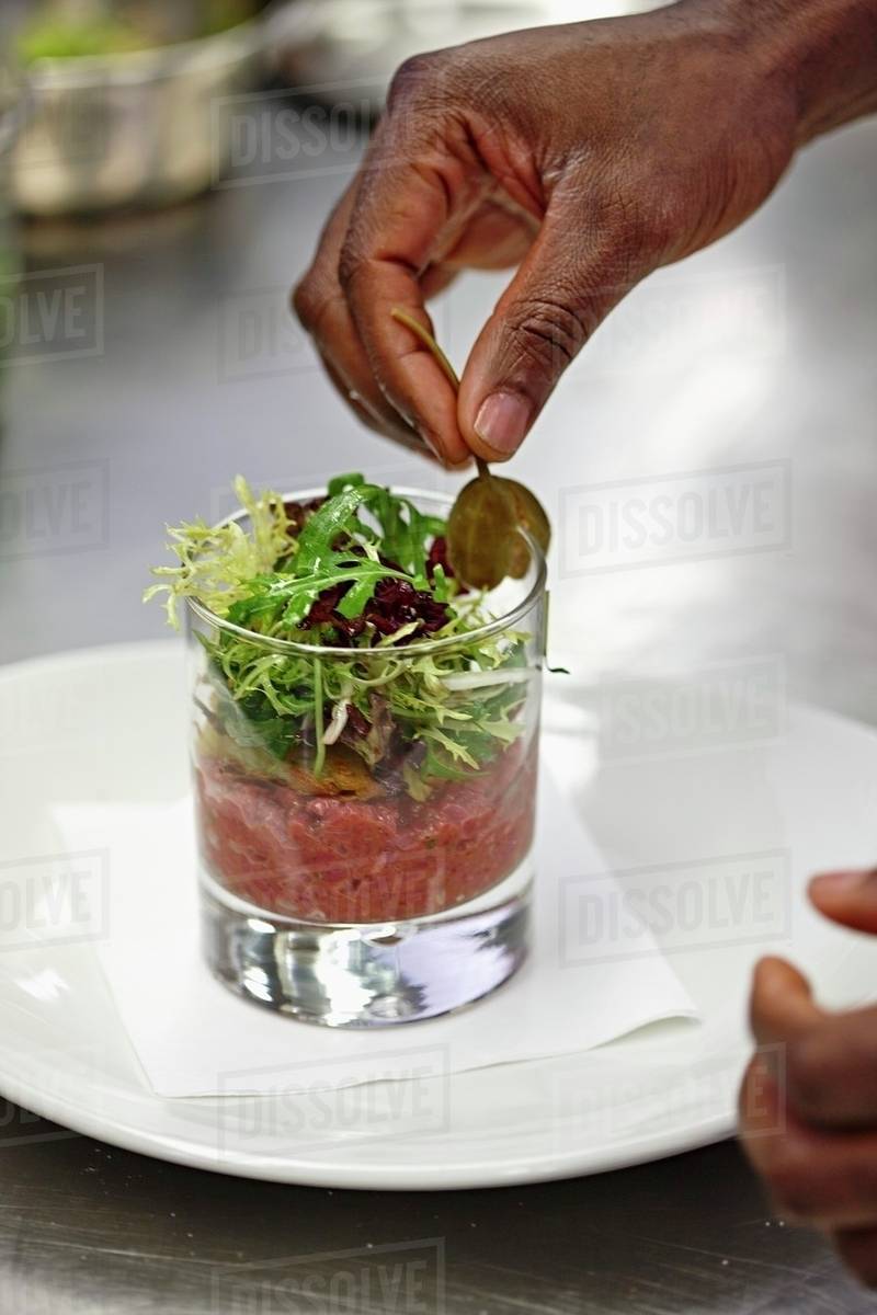 Beef tartar with lettuce - Royalty-free Stock Photo | Dissolve