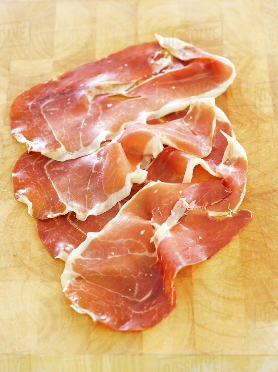 Slices of serrano ham - Royalty-free Stock Photo | Dissolve