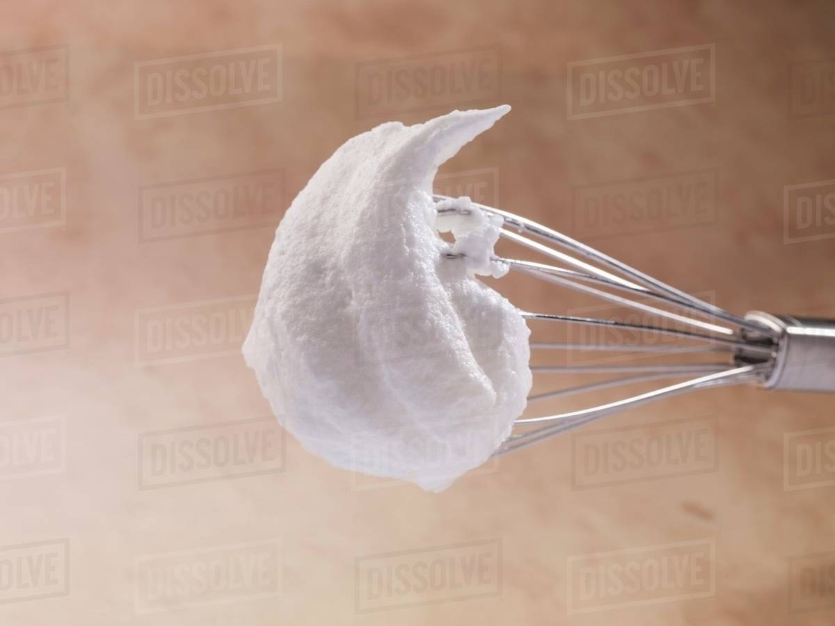 Whipped cream on a whisk - Stock Photo - Dissolve