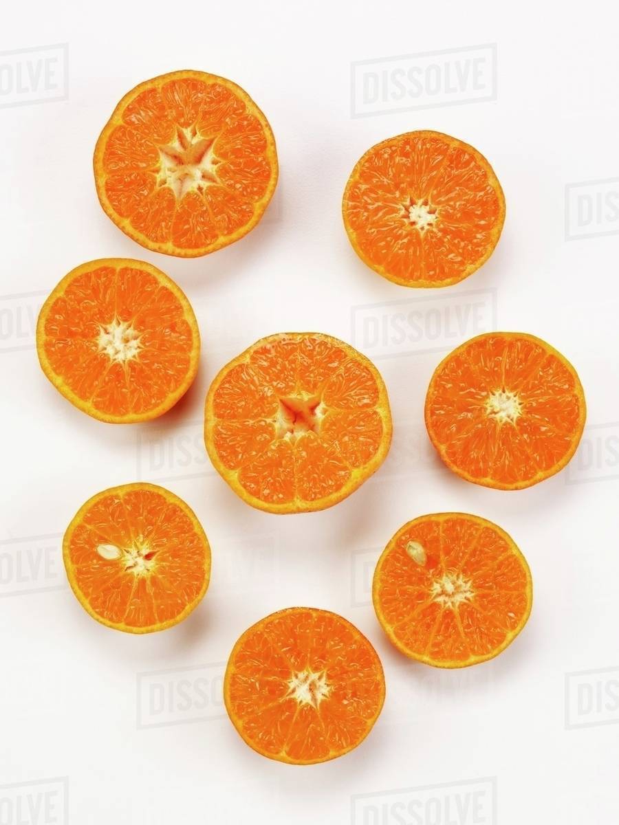 Clementine halves (seen from above) - Royalty-free Stock Photo | Dissolve