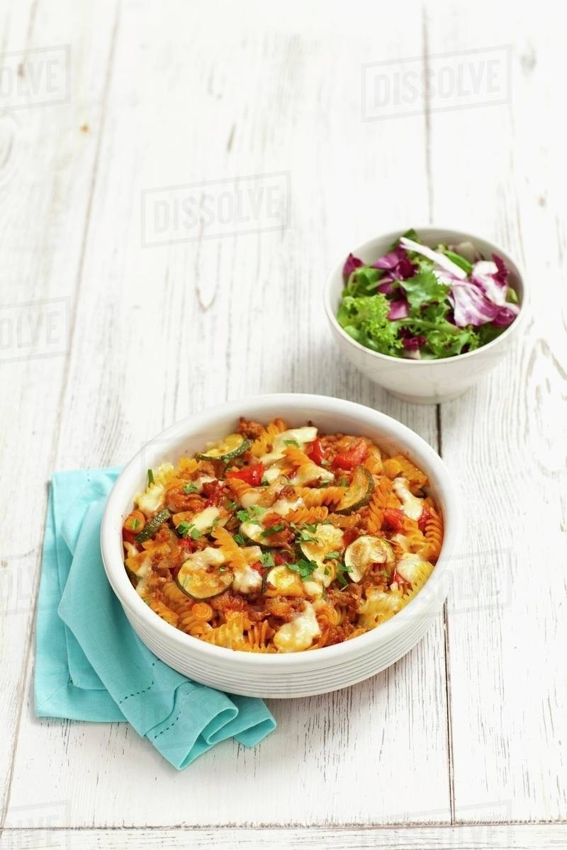 Fusilli bake with minced meat, courgettes and tomatoes - Stock Photo ...