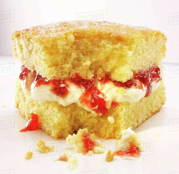 A slice of Victoria Sponge Cake with a bite take out - Royalty-free ...