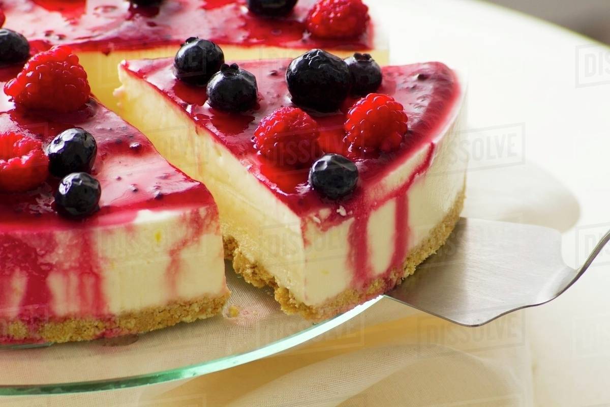 Berry cheesecake, sliced (close-up) - Royalty-free Stock Photo | Dissolve