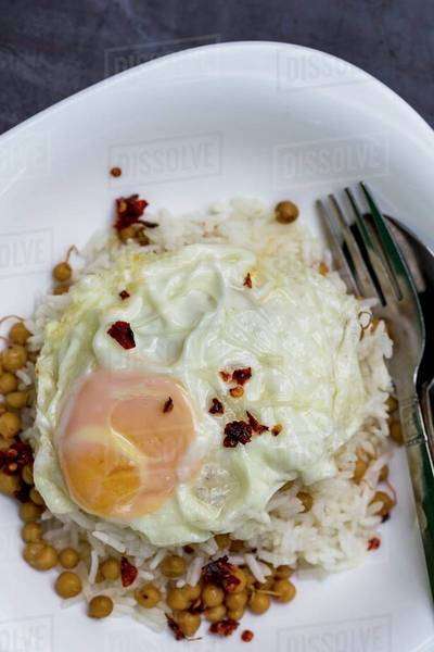 Burmese breakfast of rice, beans and fried egg - Stock Photo - Dissolve