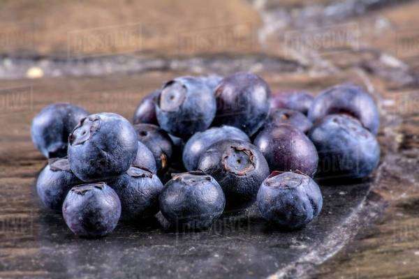 Blueberries on a stone platter - Stock Photo - Dissolve