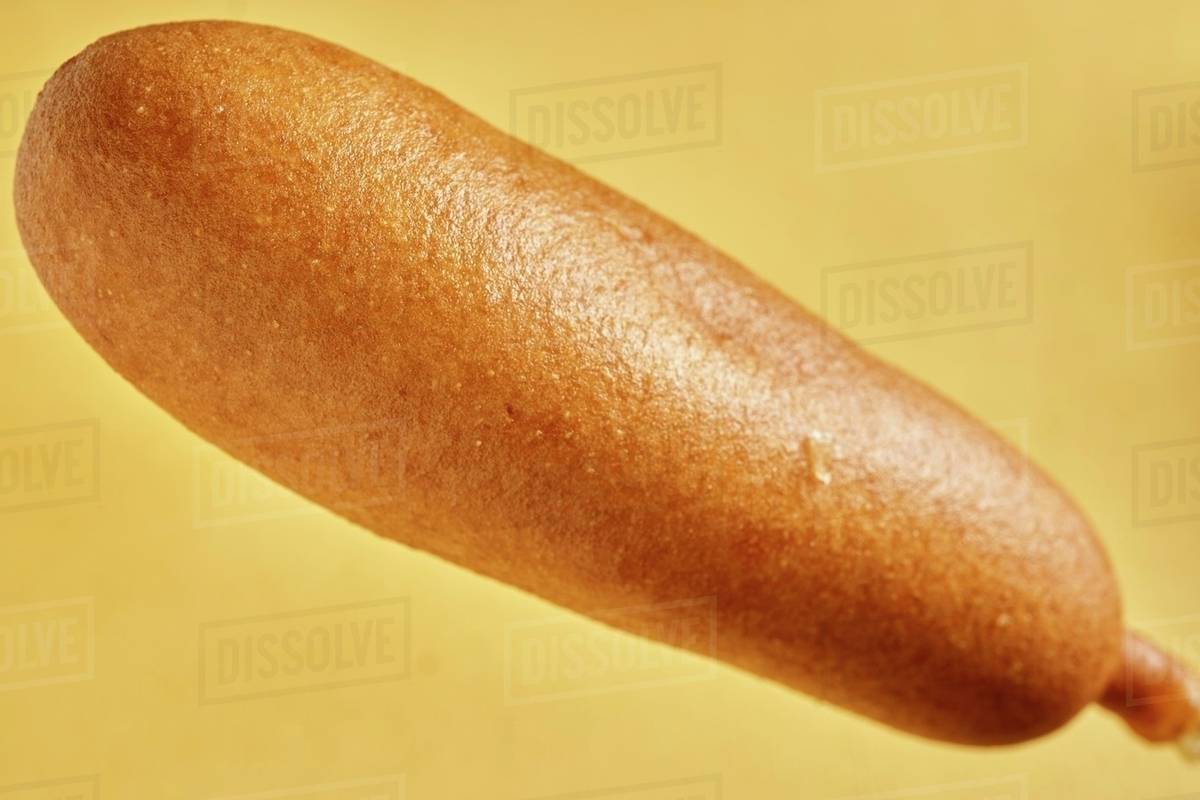 A corn dog (American speciality) - Stock Photo - Dissolve