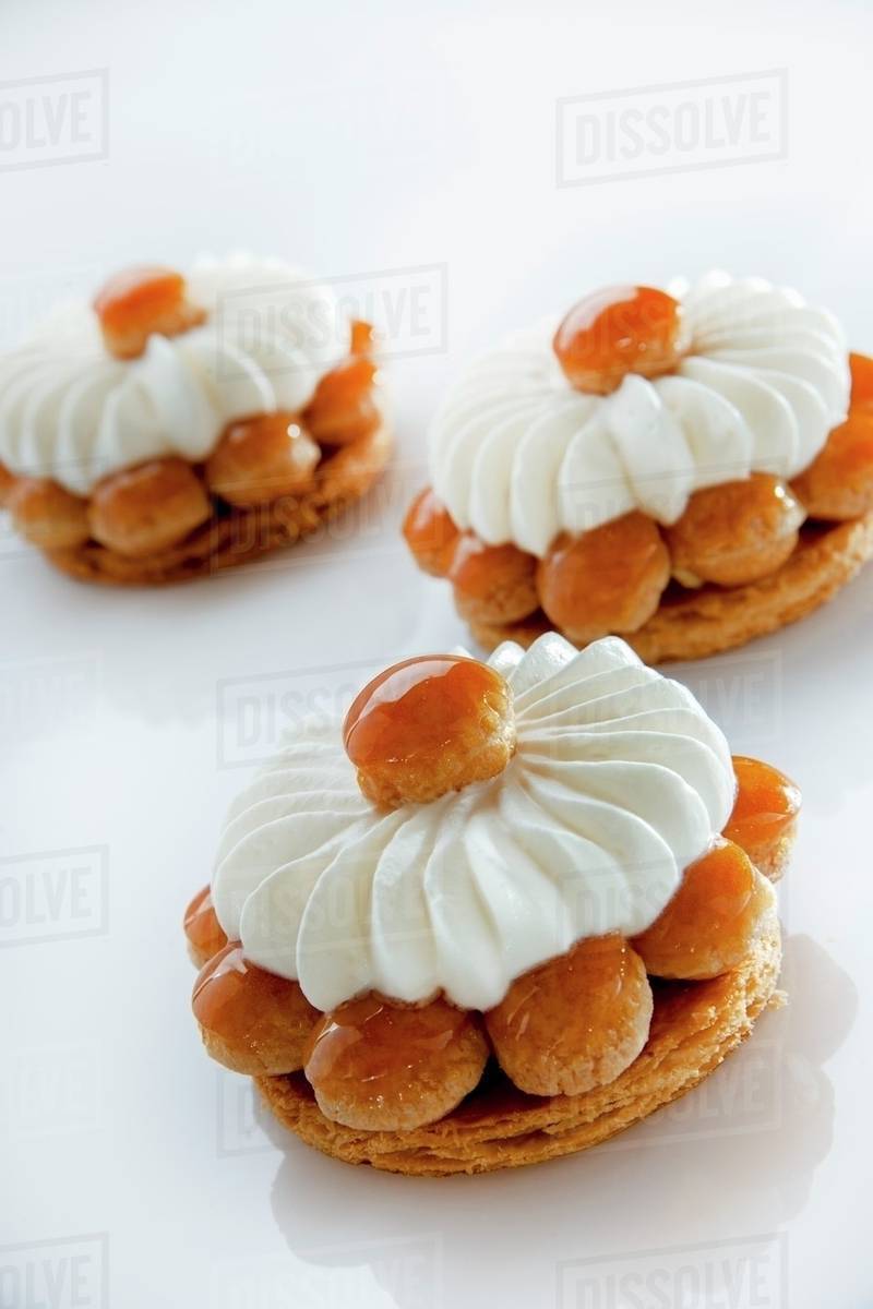 St. Honore cakes with honey - Stock Photo - Dissolve