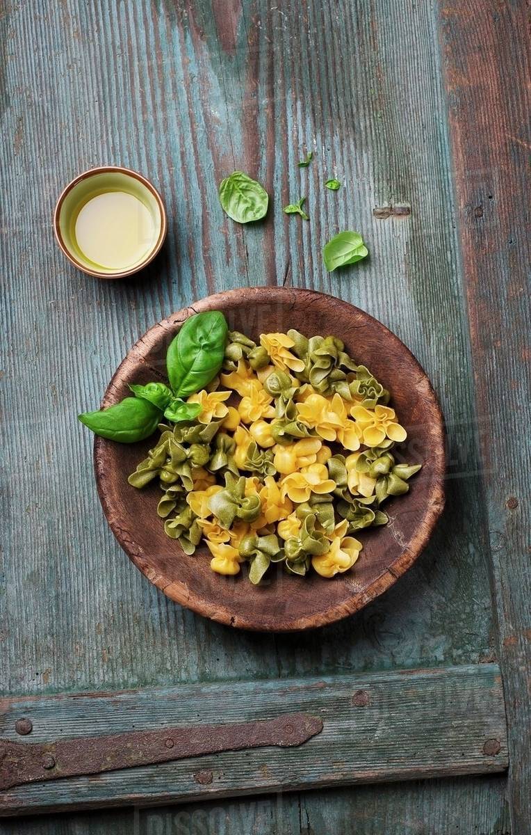 Sacchettini (stuffed pasta) in a wooden bowl - Royalty-free Stock Photo ...