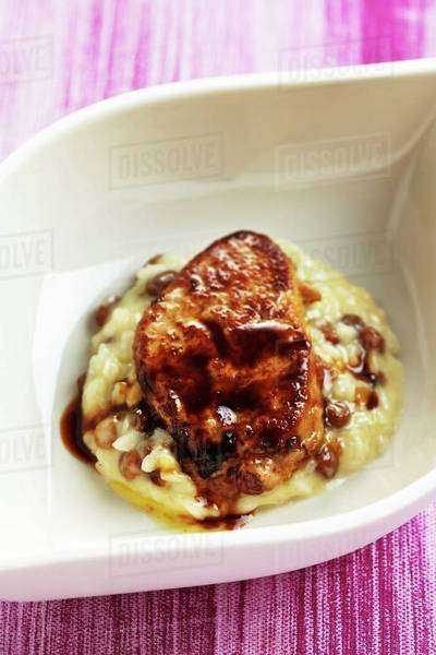 Grappa risotto with fried goose liver - Royalty-free Stock Photo | Dissolve