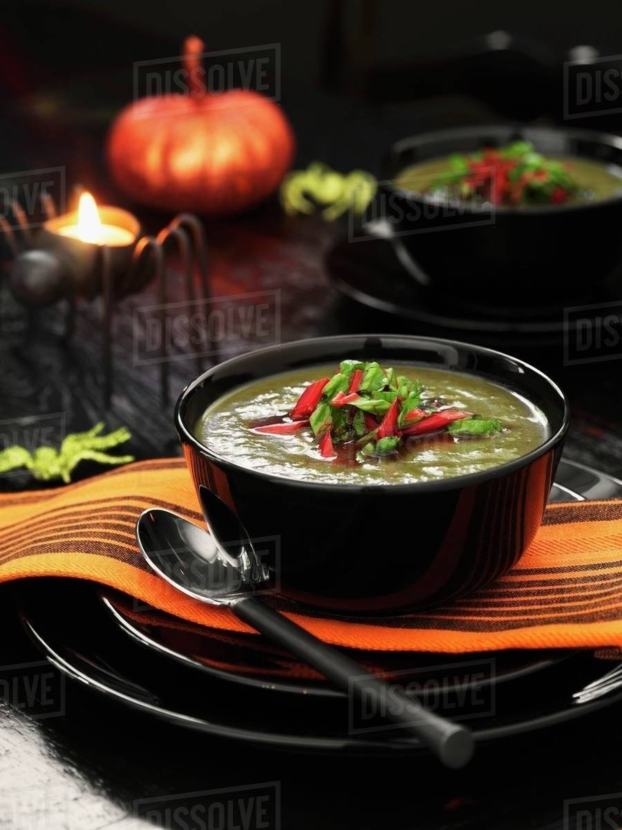 Green cream of vegetable soup at Halloween - Stock Photo - Dissolve