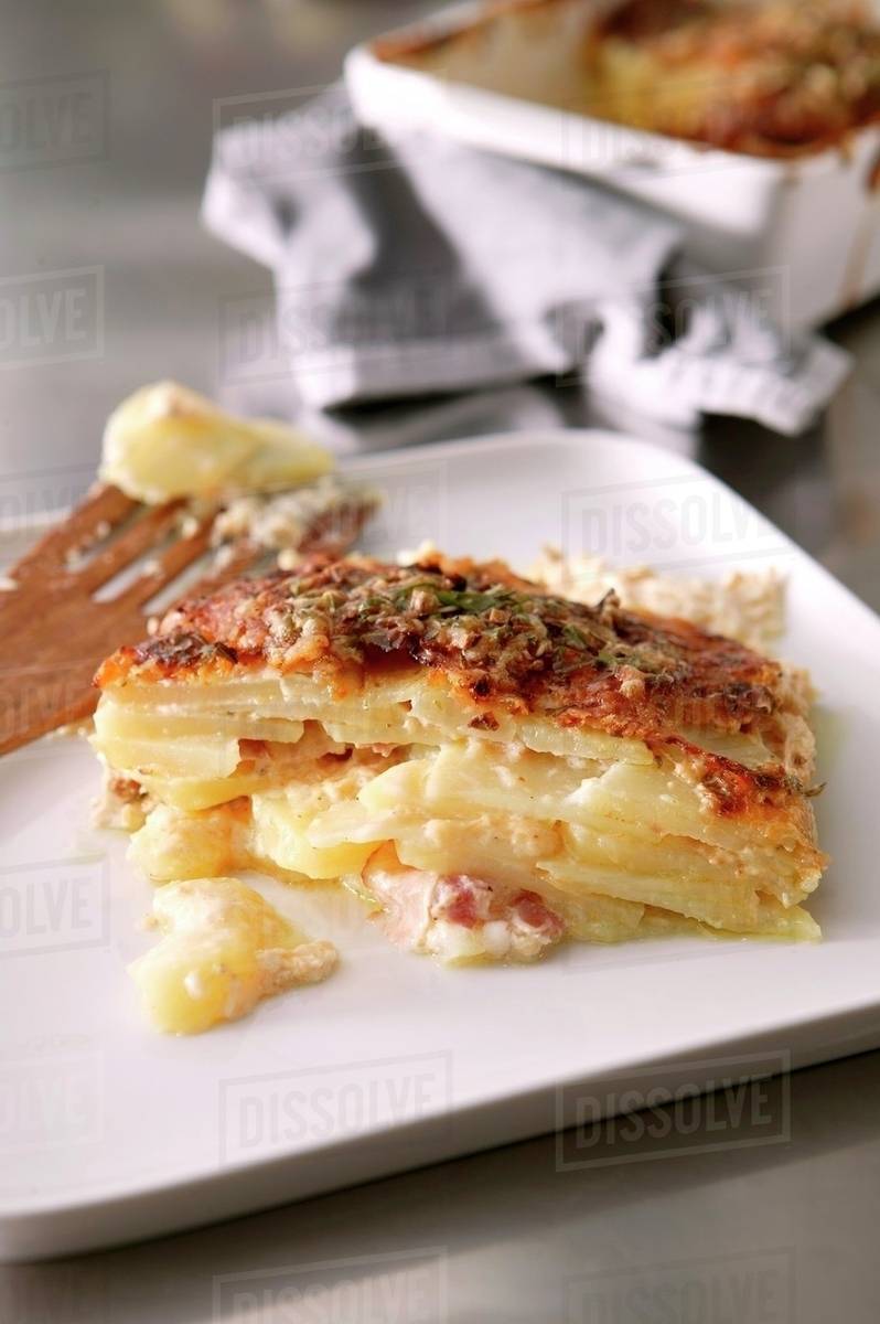 A portion of potato gratin - Stock Photo - Dissolve