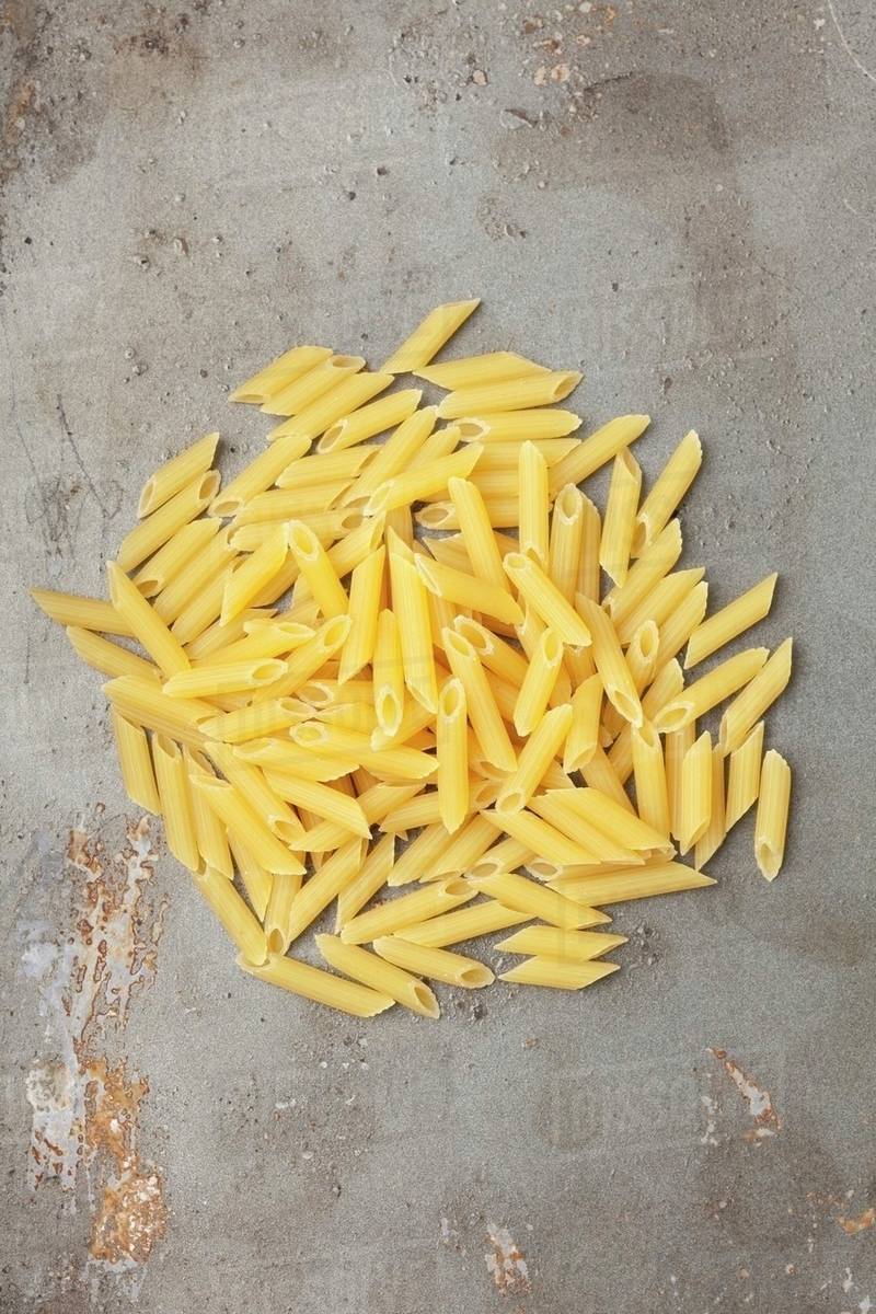A pile of penne rigate pasta - Royalty-free Stock Photo | Dissolve
