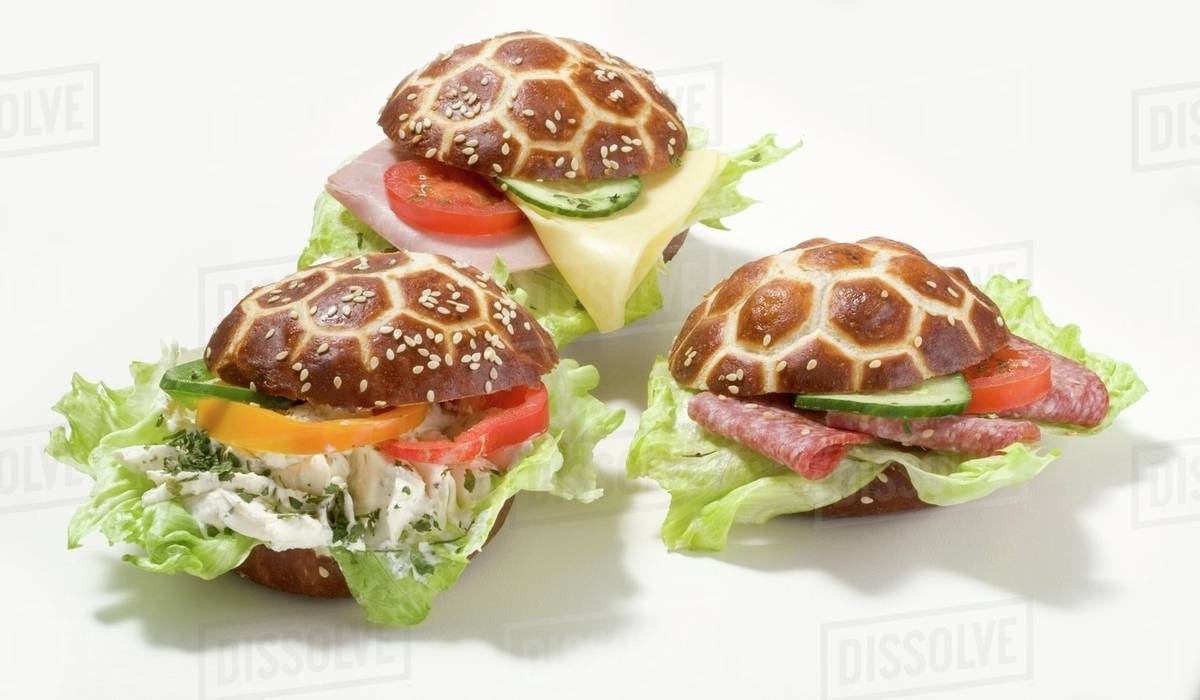 Three rye bread rolls with chicken, ham and salami - Royalty-free Stock ...