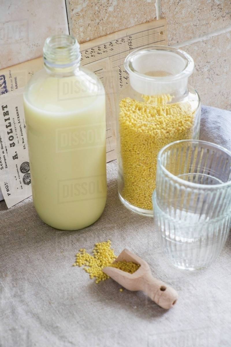 A bottle of millet milk and millet - Royalty-free Stock Photo | Dissolve