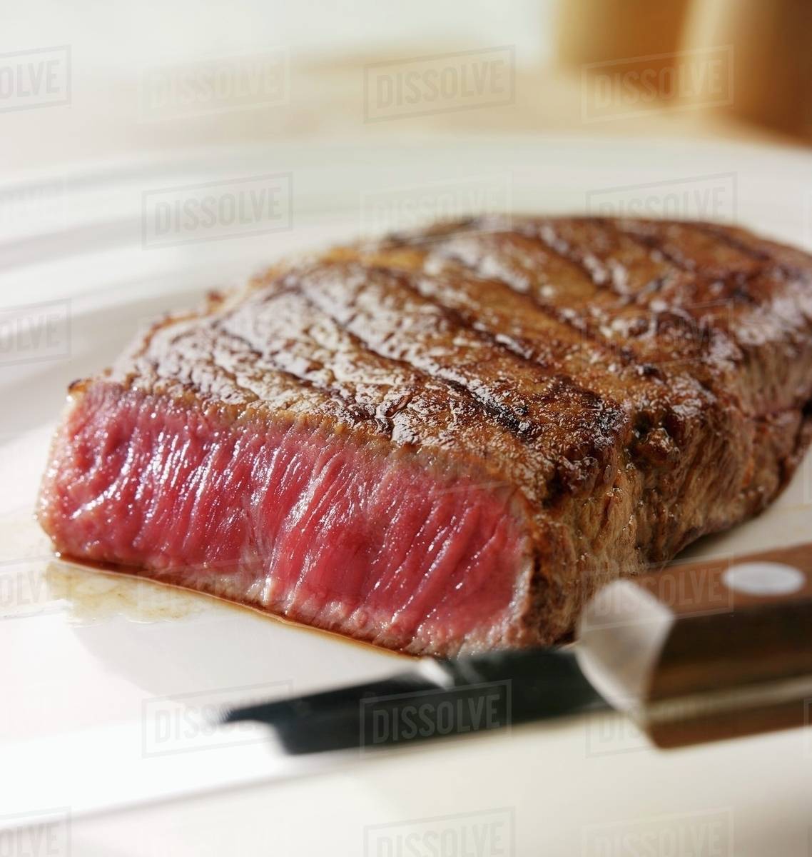 A rare sirloin steak - Royalty-free Stock Photo | Dissolve