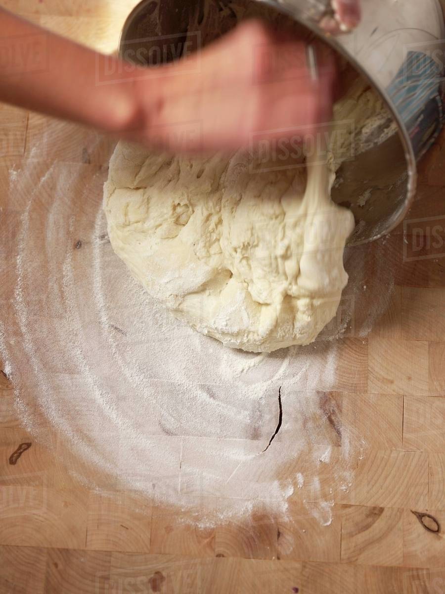 Making Bread; Dumping Dough from Pan onto Floured Surface - Stock Photo ...