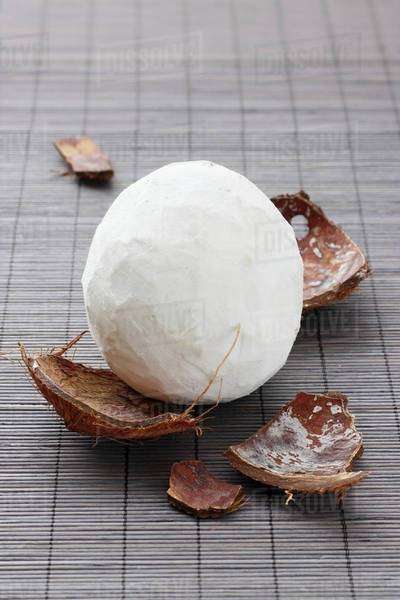 A coconut, peeled - Stock Photo - Dissolve