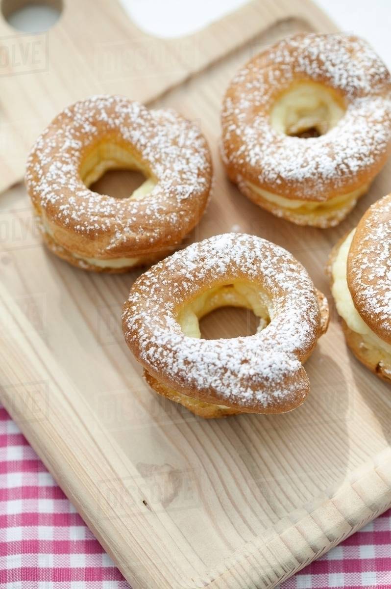 Choux pastry rings with cream filling - Stock Photo - Dissolve