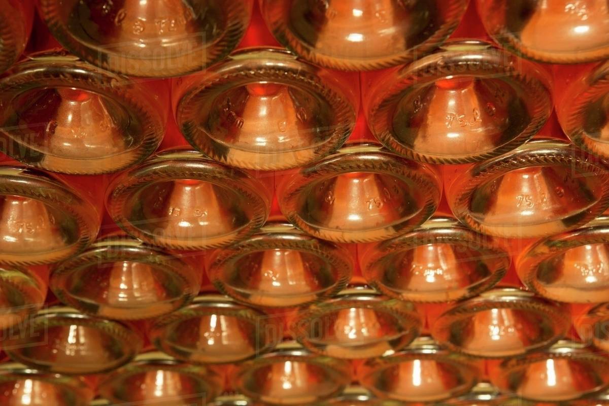 Champagne fermenting in bottles according to the champenoise method ...