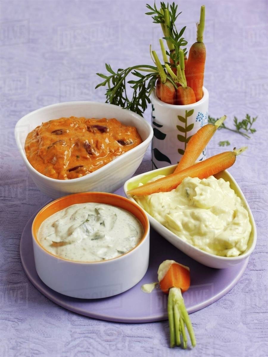 Carrots with assorted dips - Royalty-free Stock Photo | Dissolve