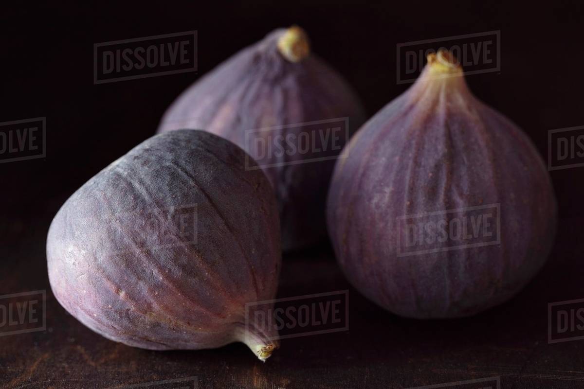 Three fresh red figs - Royalty-free Stock Photo | Dissolve