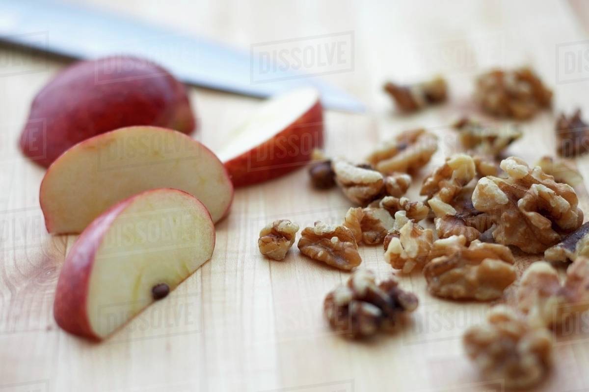 Sliced Apples and Chopped Walnuts - Royalty-free Stock Photo | Dissolve