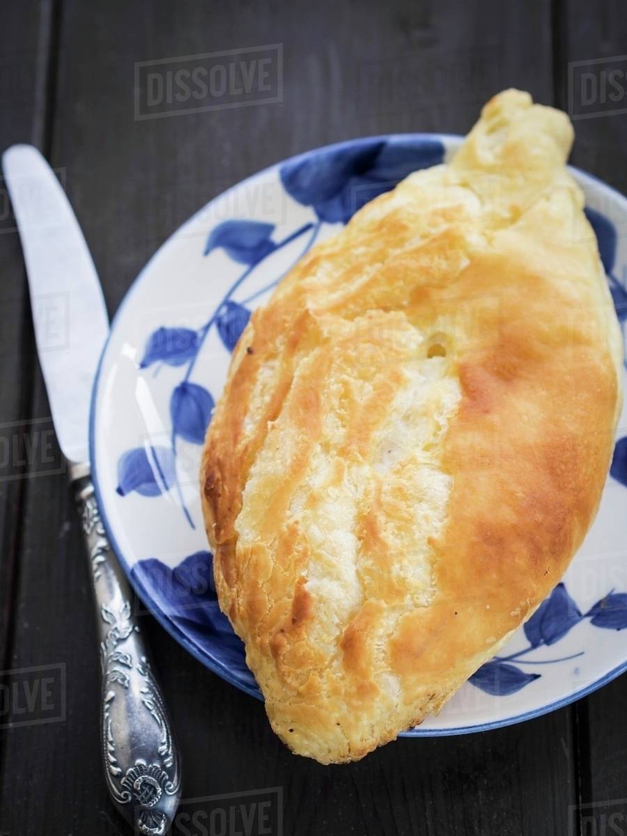 Traditional Georgian cheese bread (khachapuri) called nahevrad penovani ...